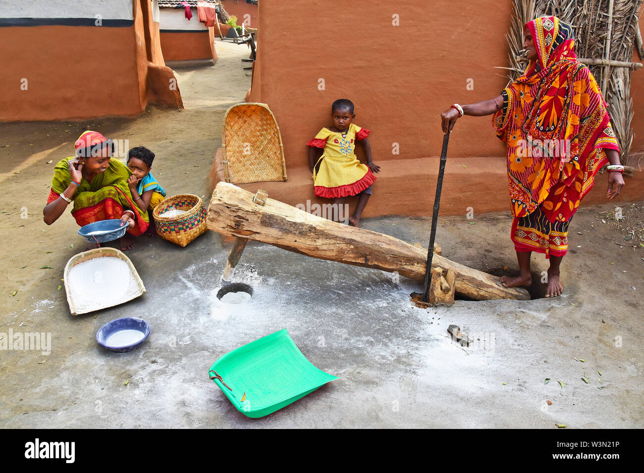 A tribal family busy at the remote village of Purulia India Stock Photo ...