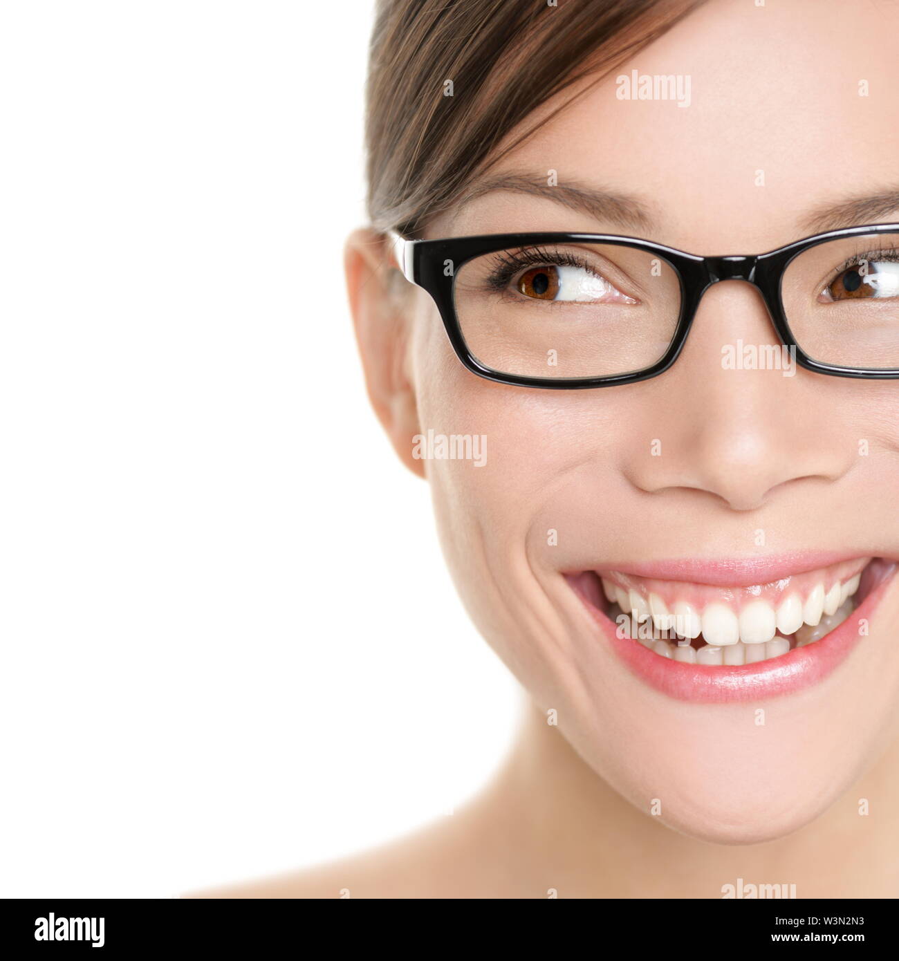 Woman wearing glasses looking happy to side. Eyewear woman with big ...