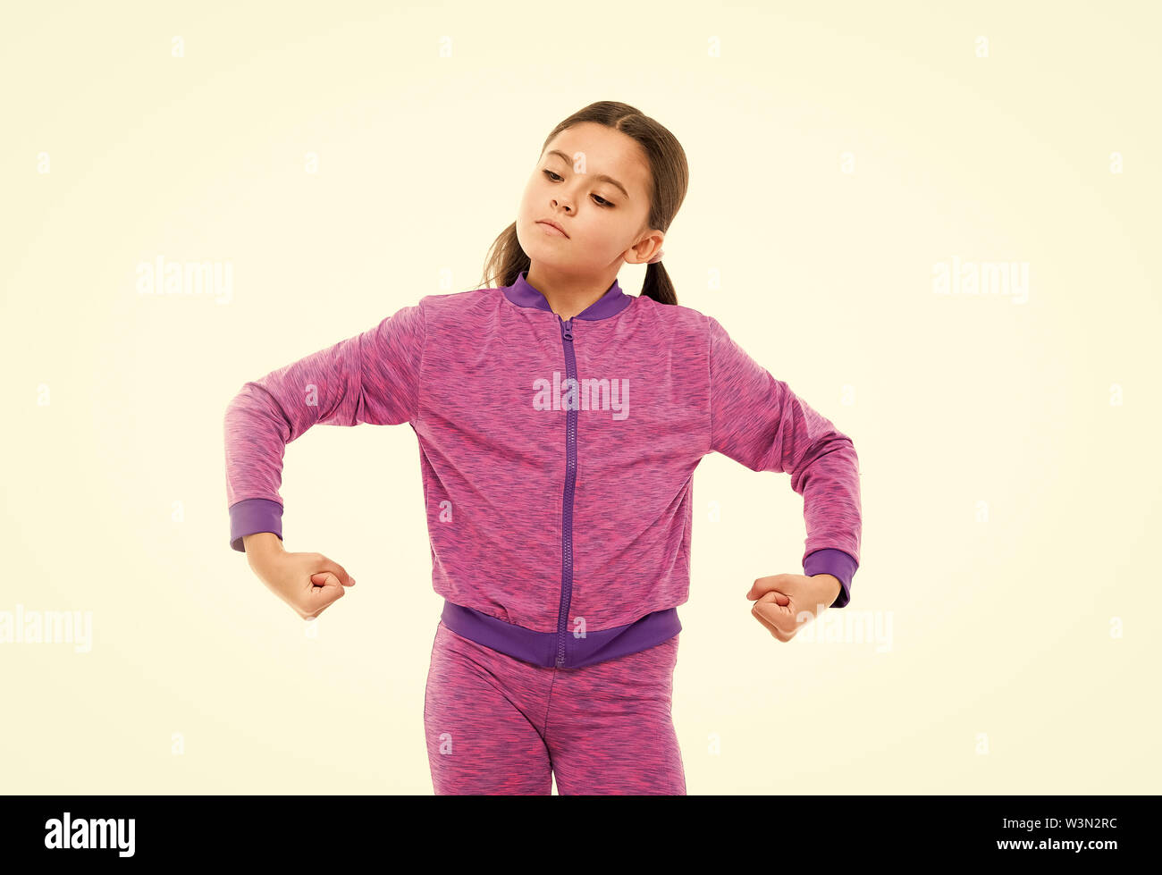 Feel so strong. Child cute girl show biceps gesture of power and ...