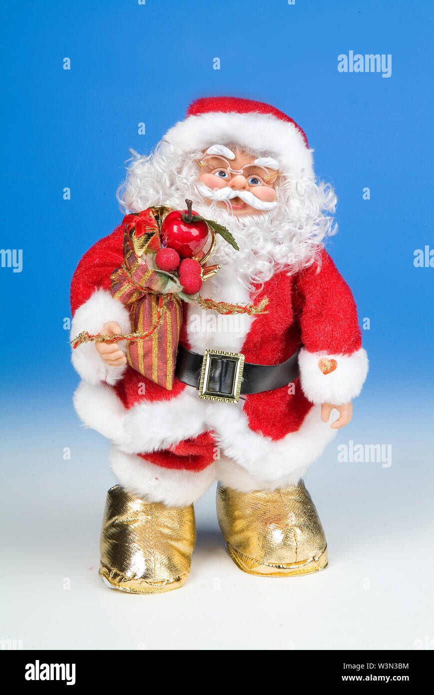Santa Klaus statuette on a studio background Stock Photo - Alamy