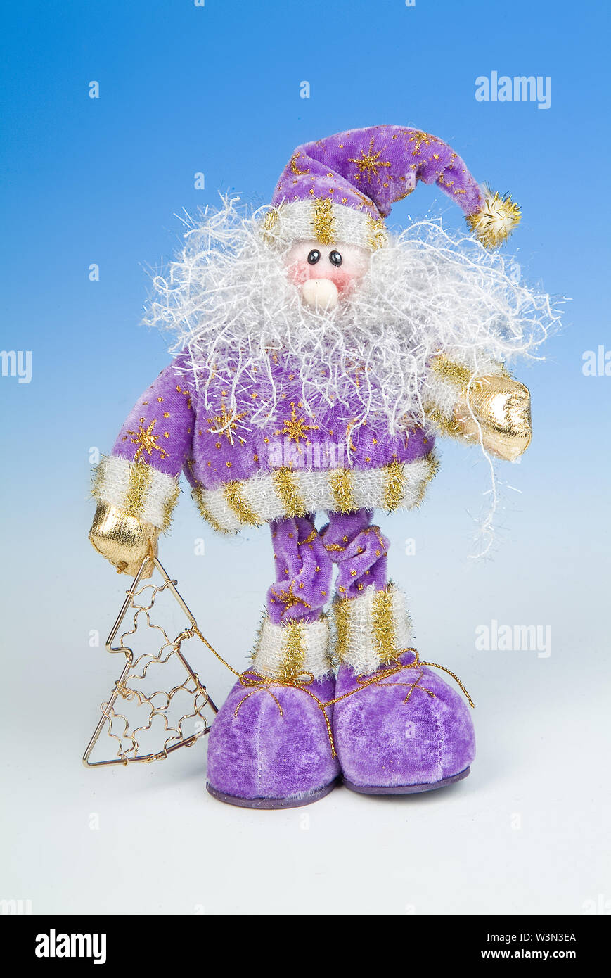 Santa Klaus statuette on a studio background Stock Photo - Alamy