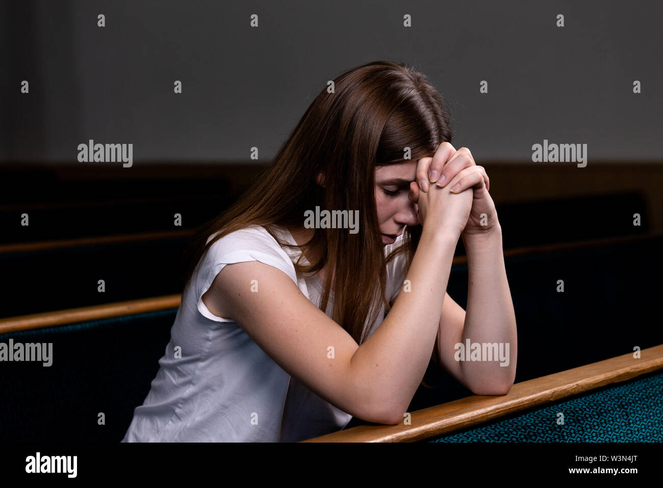 Young sad christian woman praying hi-res stock photography and images ...