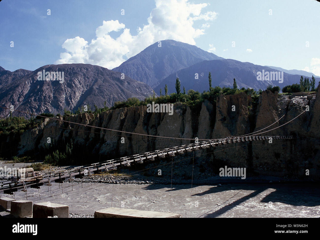 A hanging bridge over a river, in Gilgit in the northern region of ...