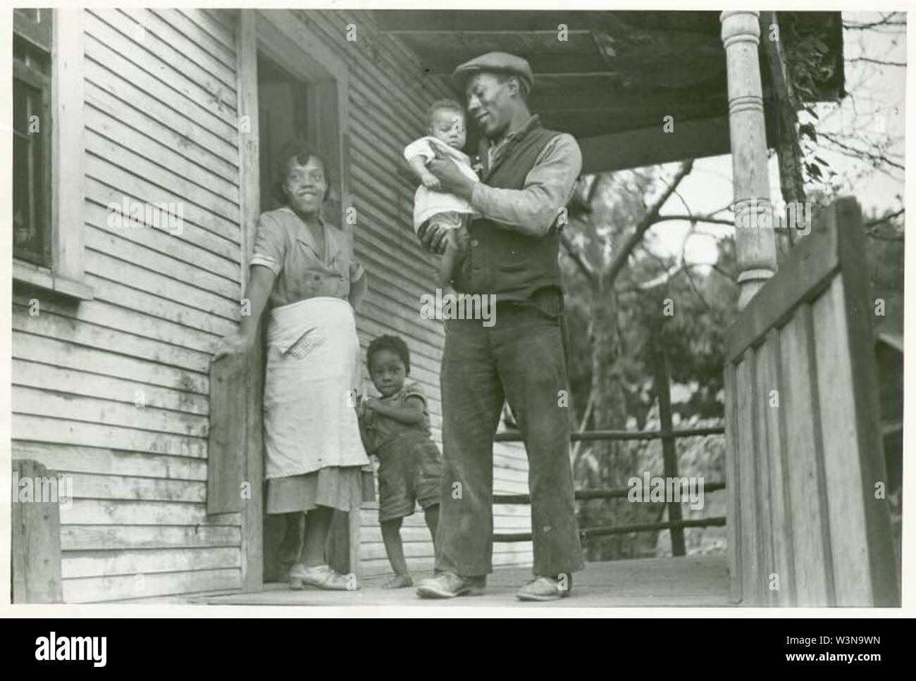 Coal miner his wife and two children (notice the child's l ...