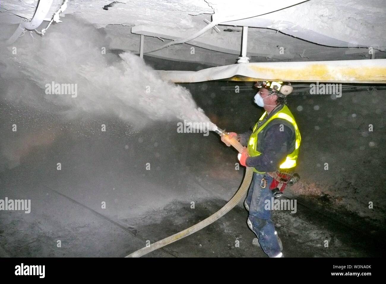 Coal miner spraying rock dust Stock Photo - Alamy