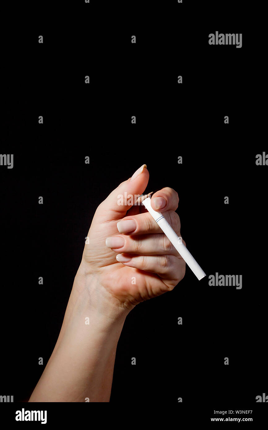 Holding an unlit cigarette hi-res stock photography and images - Alamy