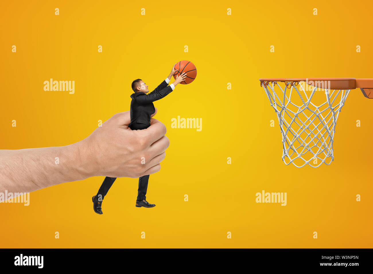 Big male hand holding businessman with basketball ball reaching out to ...