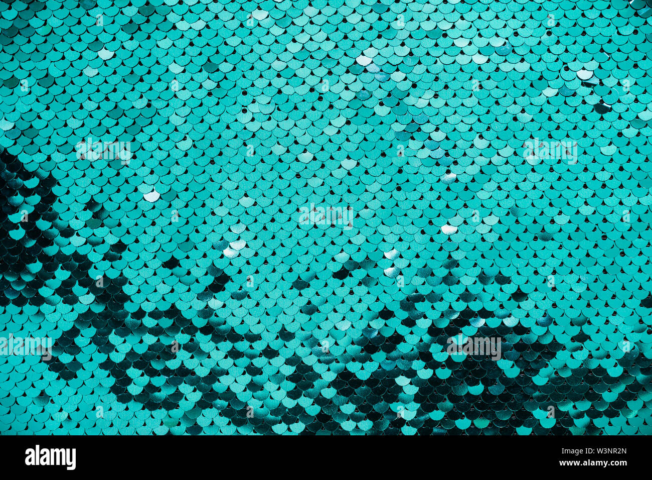 Abstract festive sparkling background. Round iridescent turquoise ...