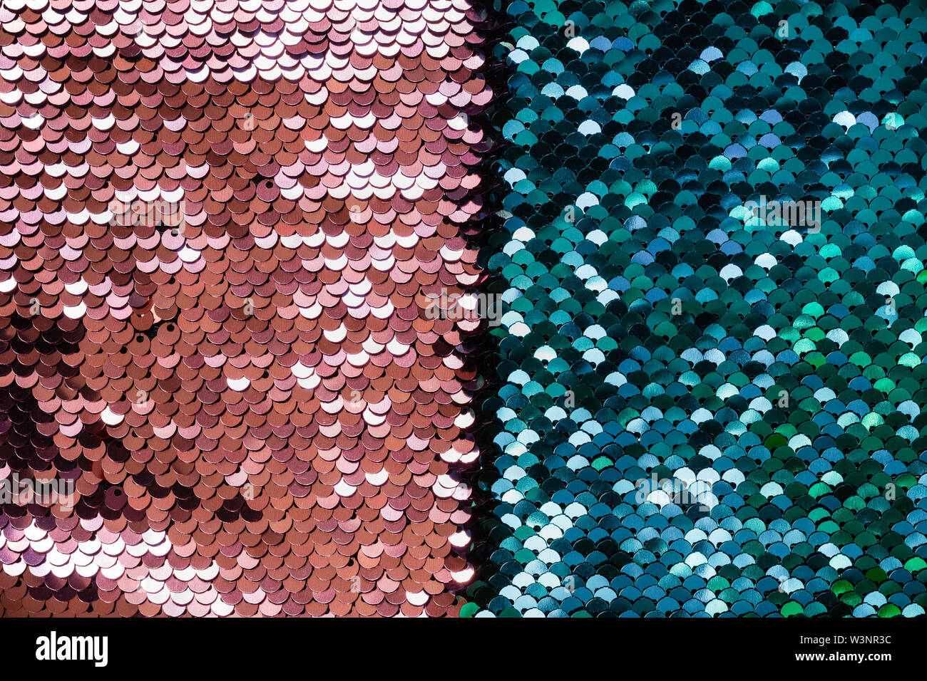 Luxury abstract background with coral and turquoise sequins on fabric ...