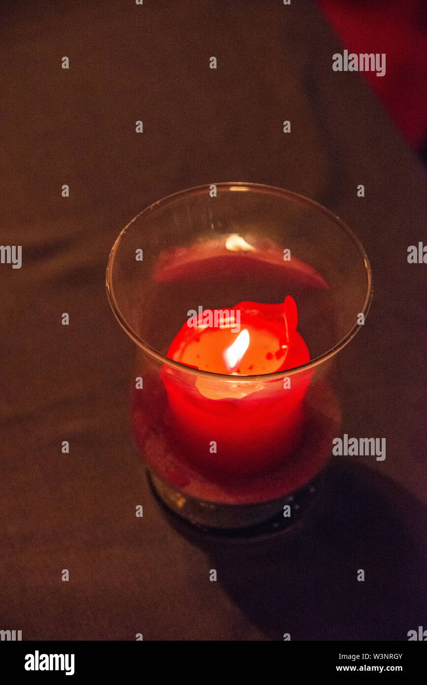 Red candle lit hi-res stock photography and images - Alamy
