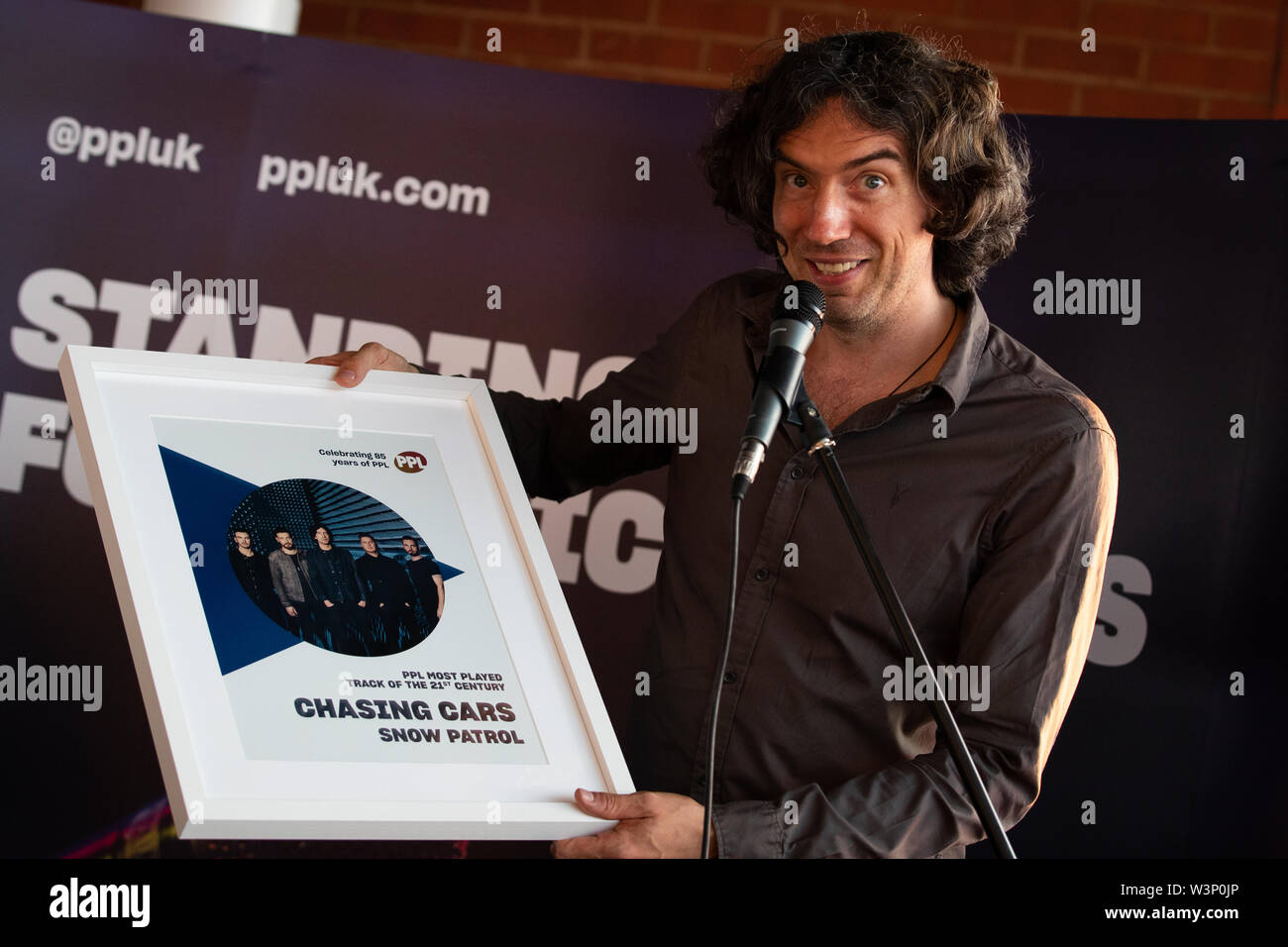Frontman of Snow Patrol Gary Lightbody receives the award for Most ...