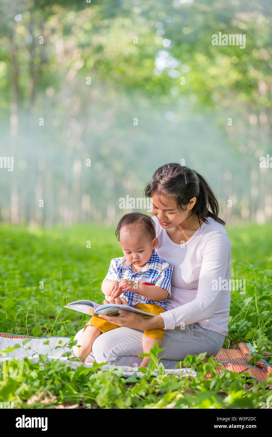 Asian boy reading floor hi-res stock photography and images - Alamy