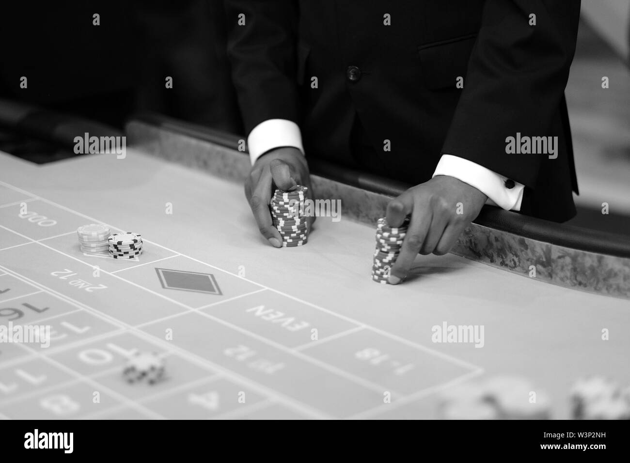 Croupier chips Black and White Stock Photos & Images - Alamy