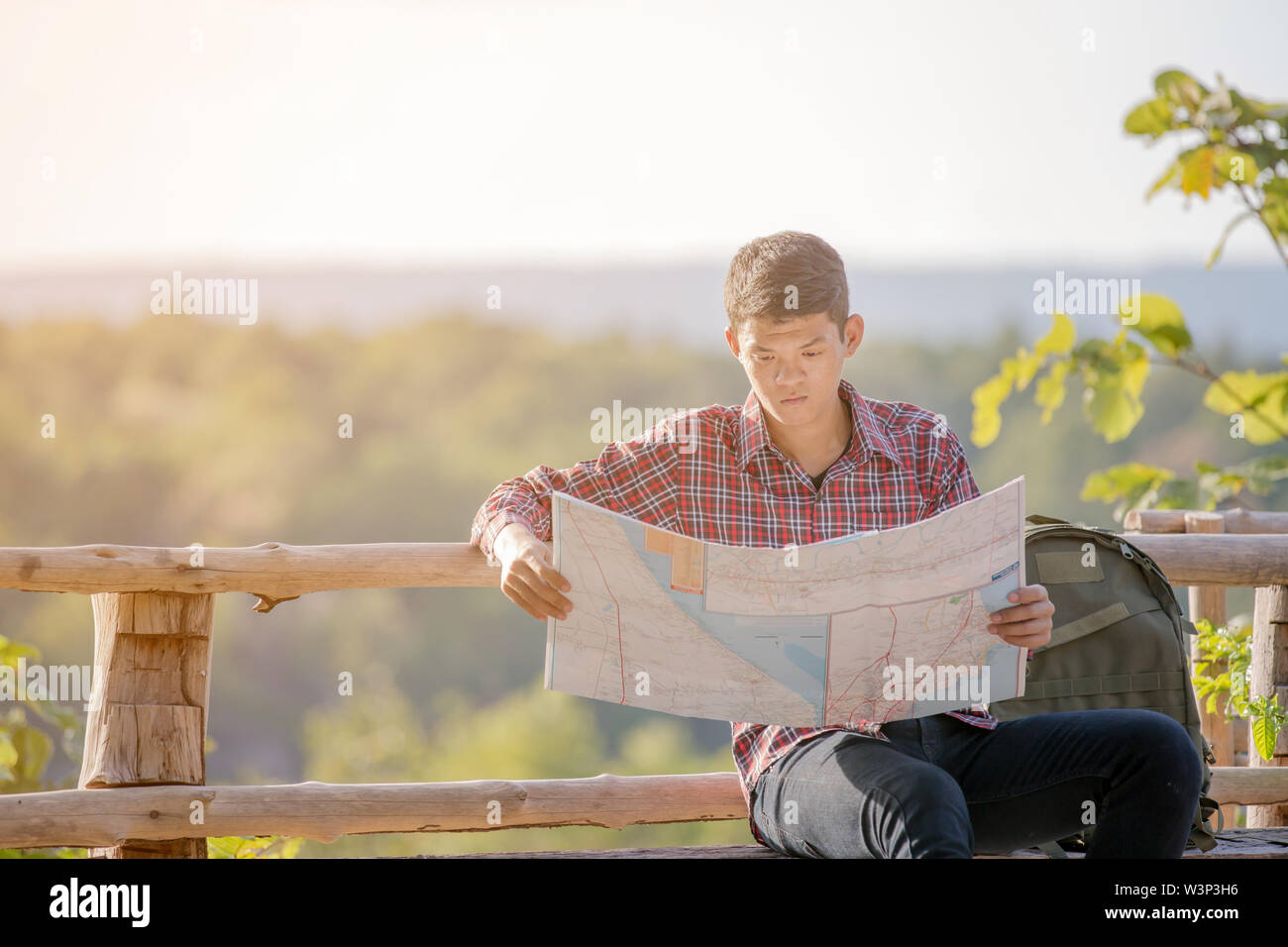 Man tourist in mountain read the map. Tourism concept Stock Photo - Alamy