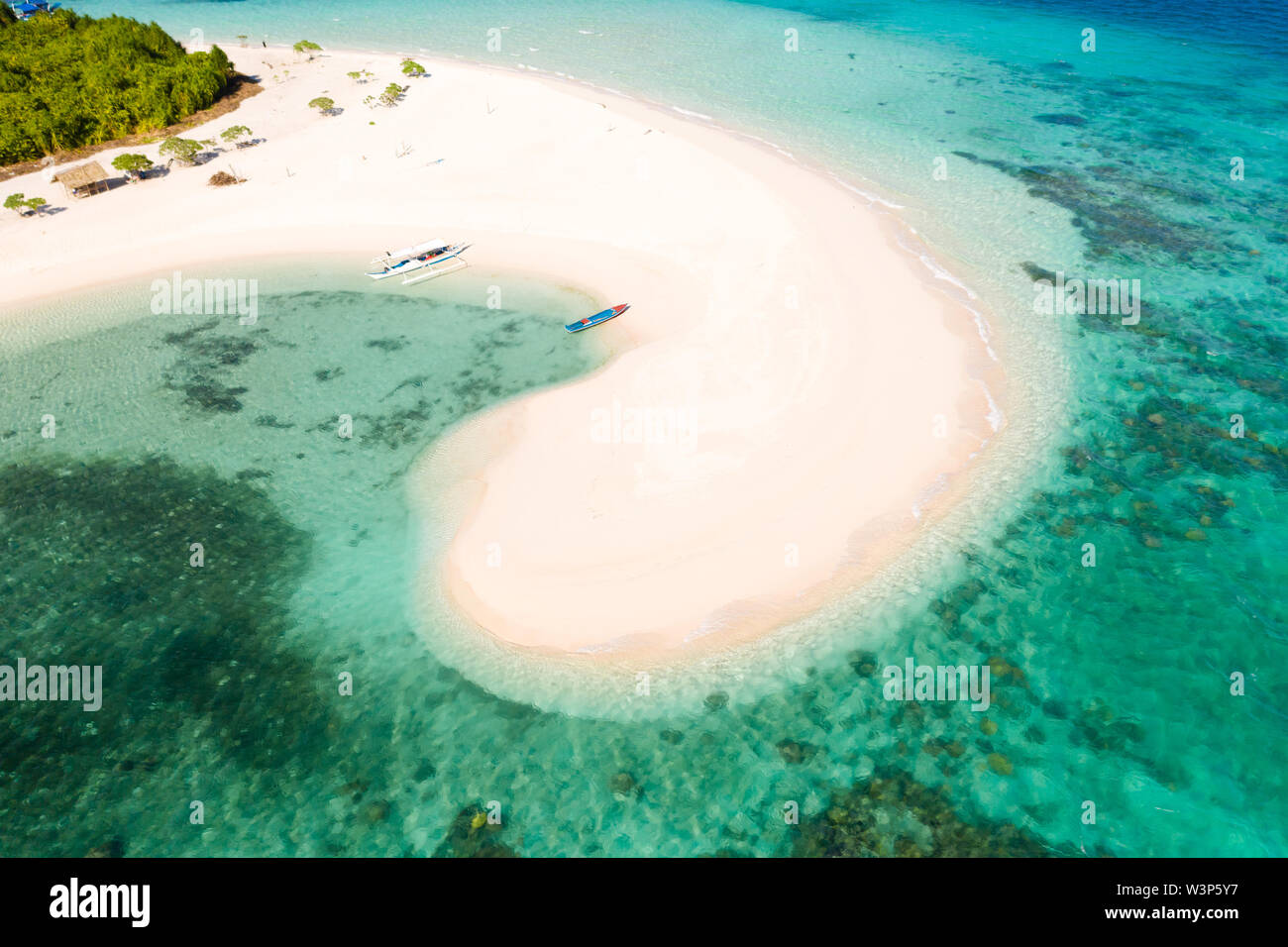 Patawan island. Small tropical island with white sandy beach. Beautiful ...