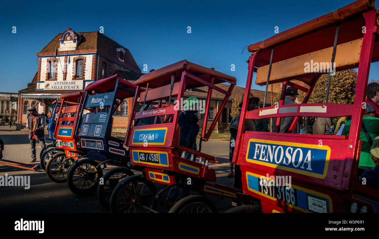 Colourful rickshaws waiting for clients at Antsirabe, National Road 7 ...