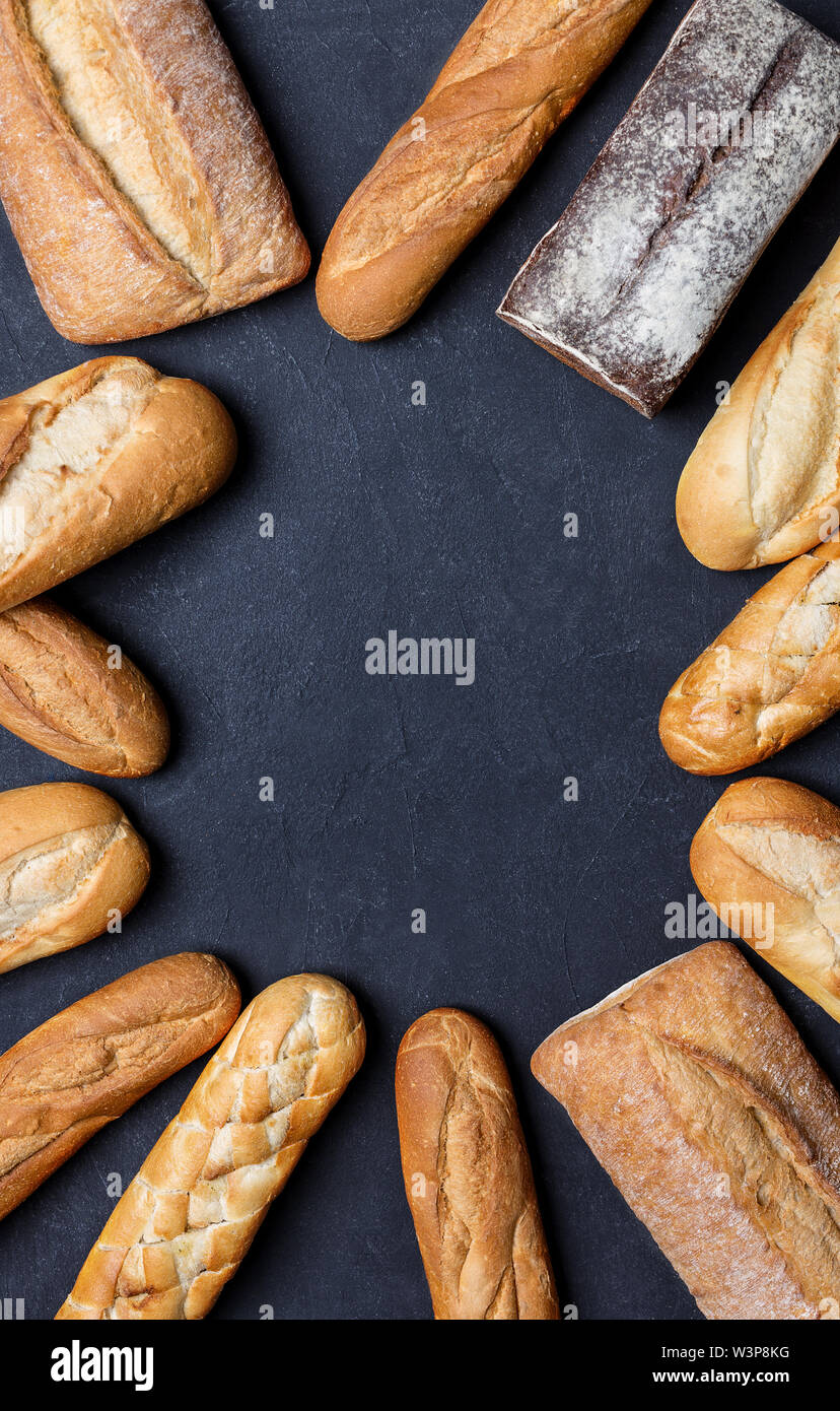 Border with bread around at black background. Top view, flat lay, space ...