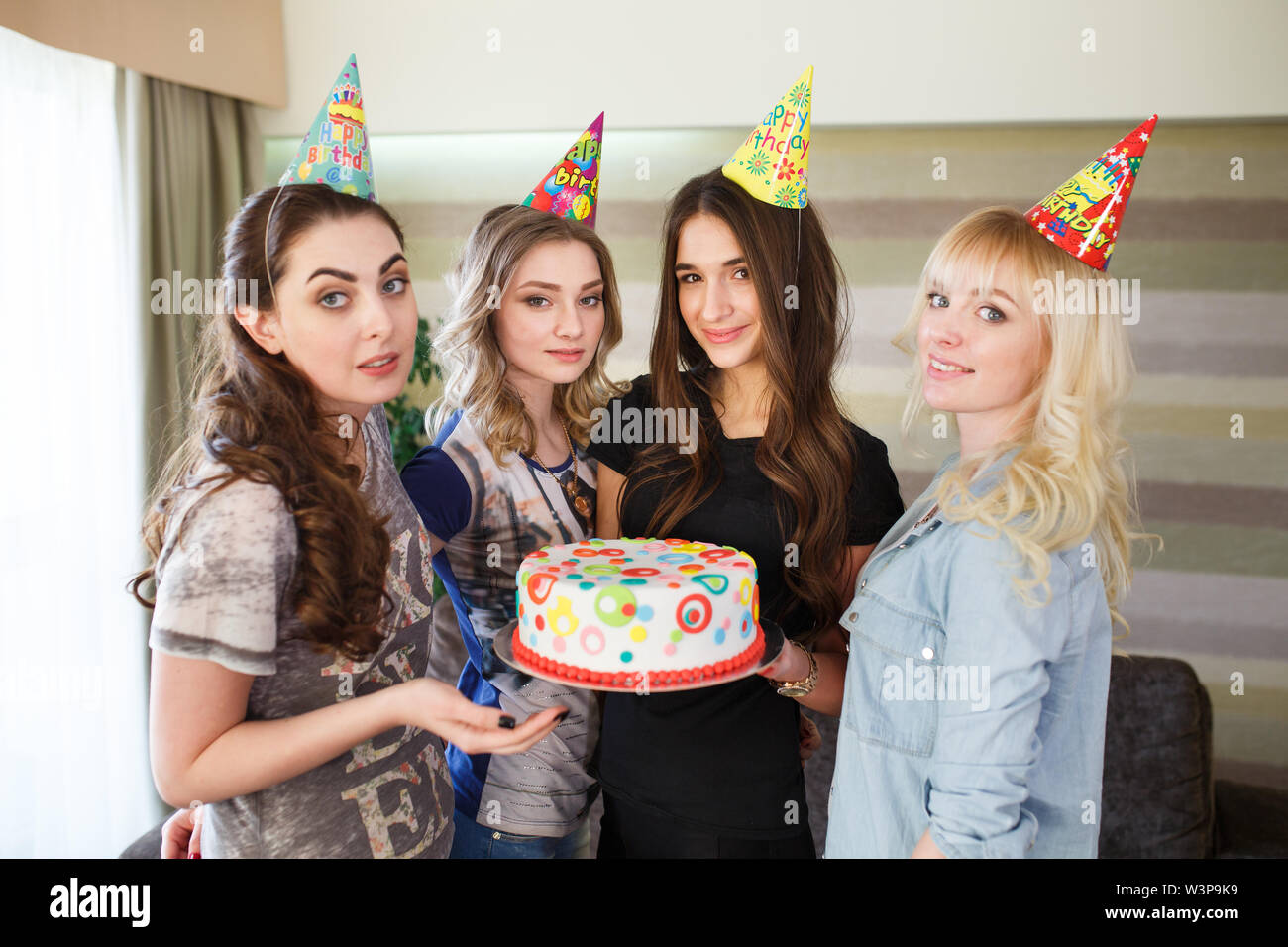 Birthday. Girls posing with cake on birthday Stock Photo - Alamy