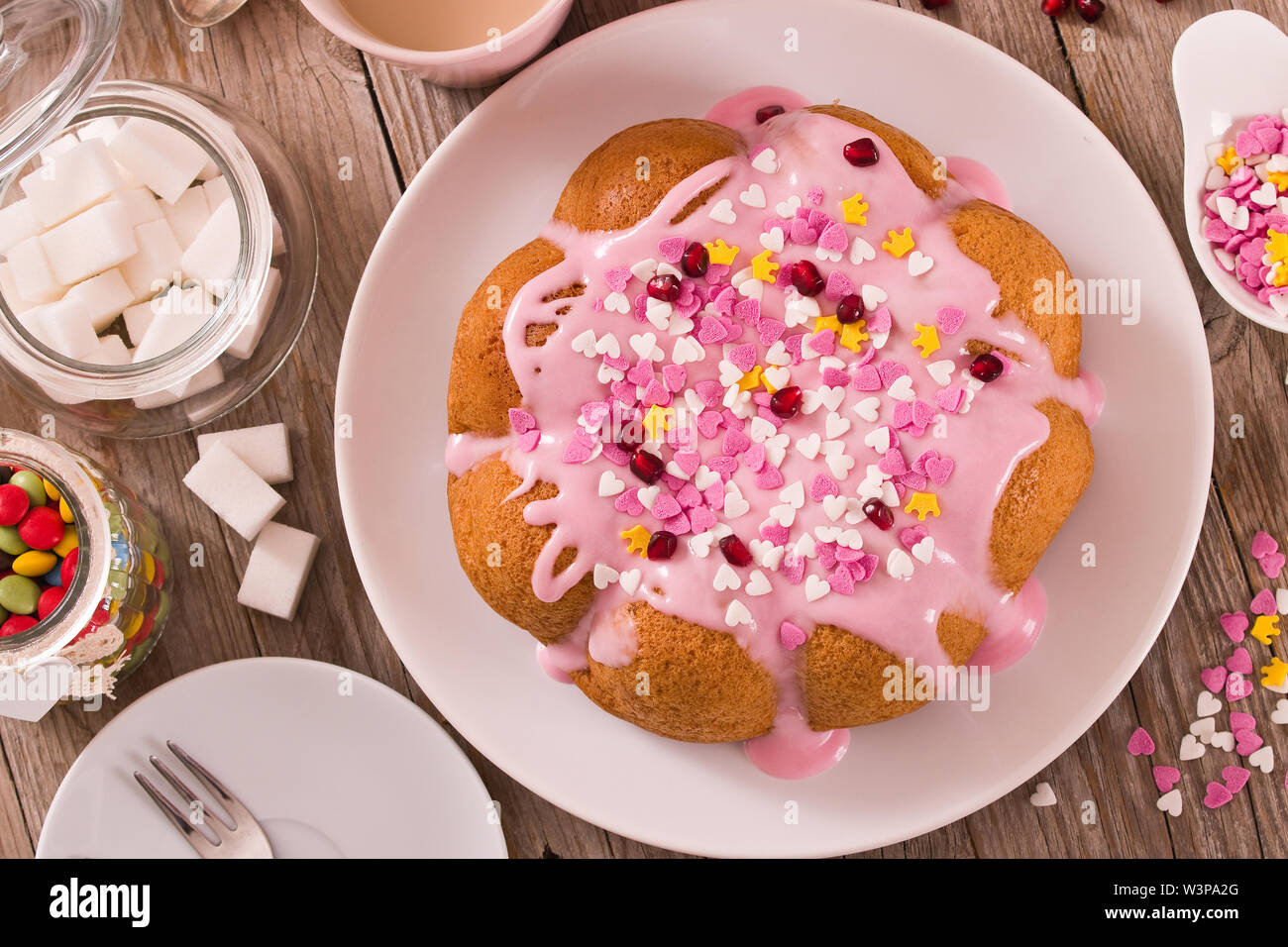 Cake with pink frosting Stock Photo - Alamy