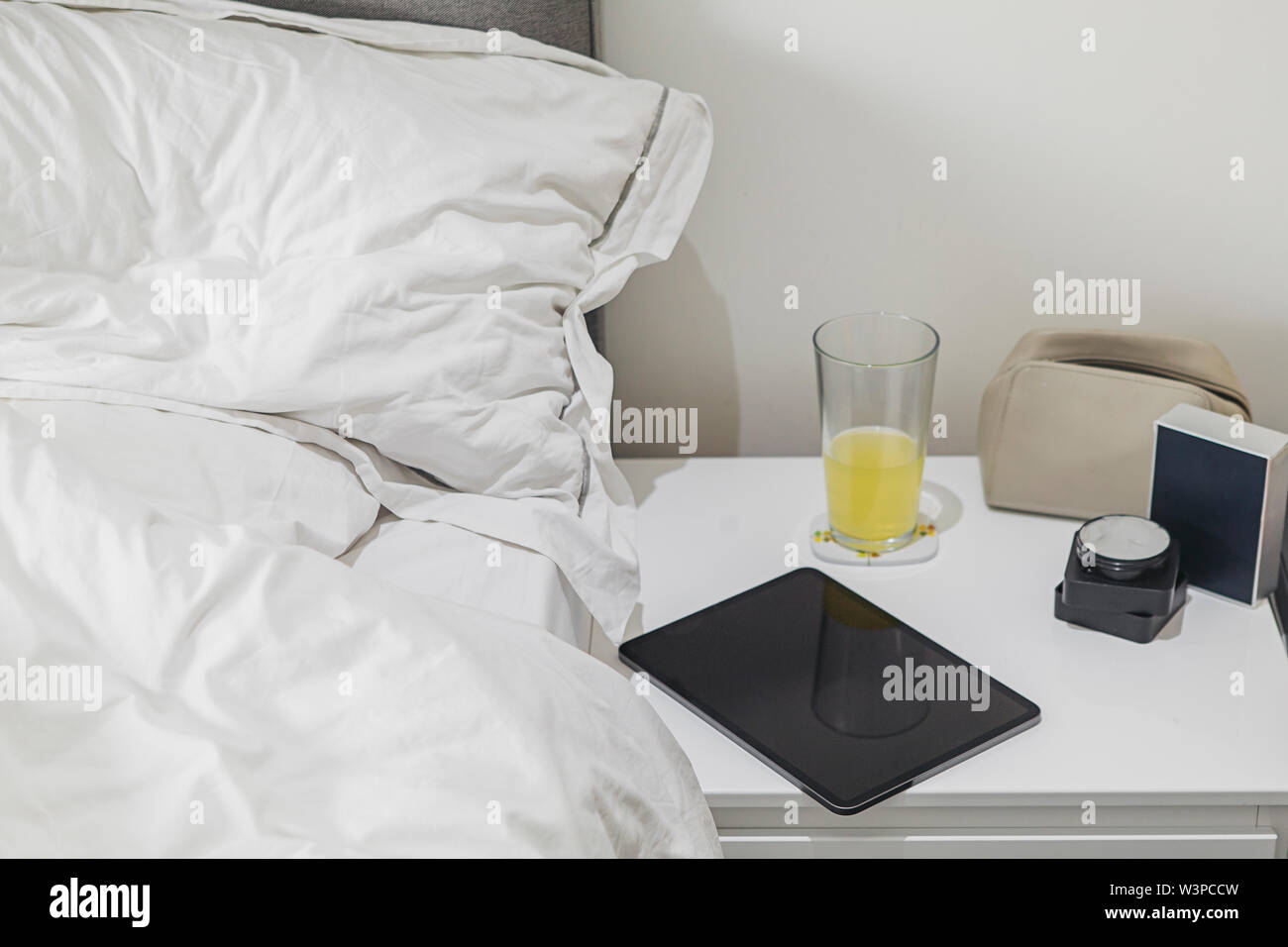 Tablet computer next to the bed Stock Photo - Alamy