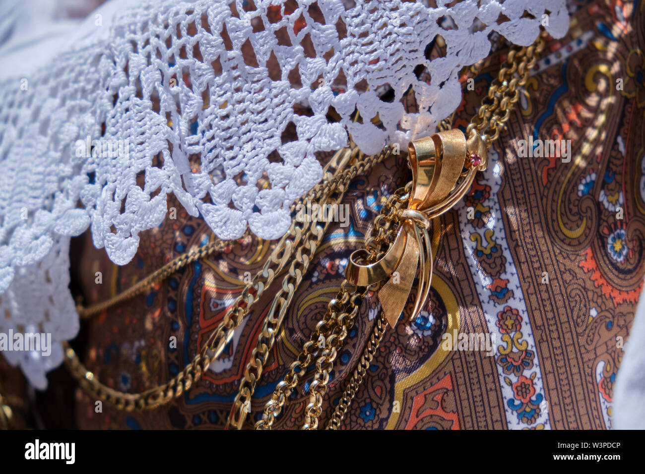 A woman dressed in typical Sardinian costume with different Sardinian ...