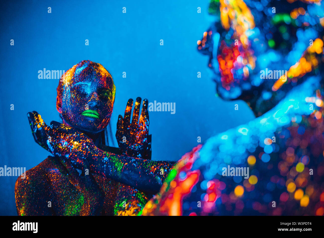 People colored fluorescent powder hi-res stock photography and images ...