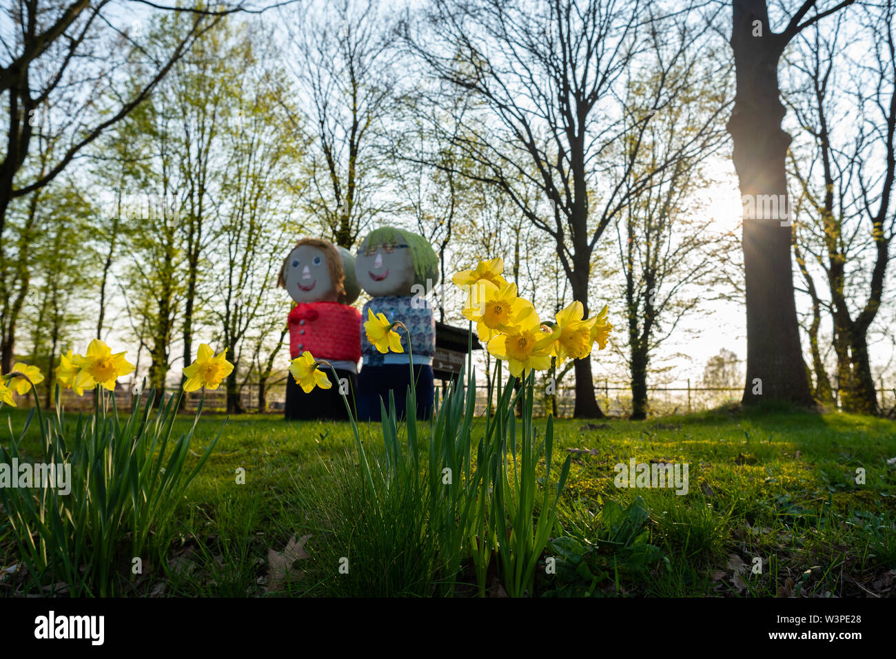 Humans from hay bales stand at the roadside Stock Photo - Alamy