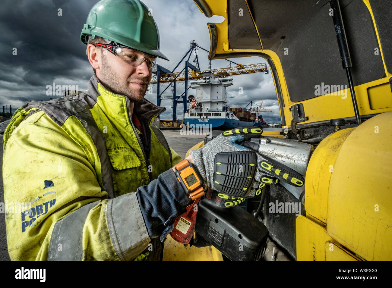 Skilled workers using power tools Stock Photo - Alamy
