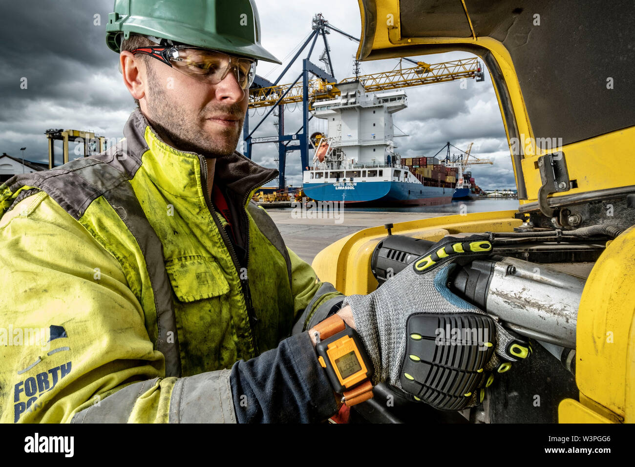 Skilled workers using power tools Stock Photo - Alamy