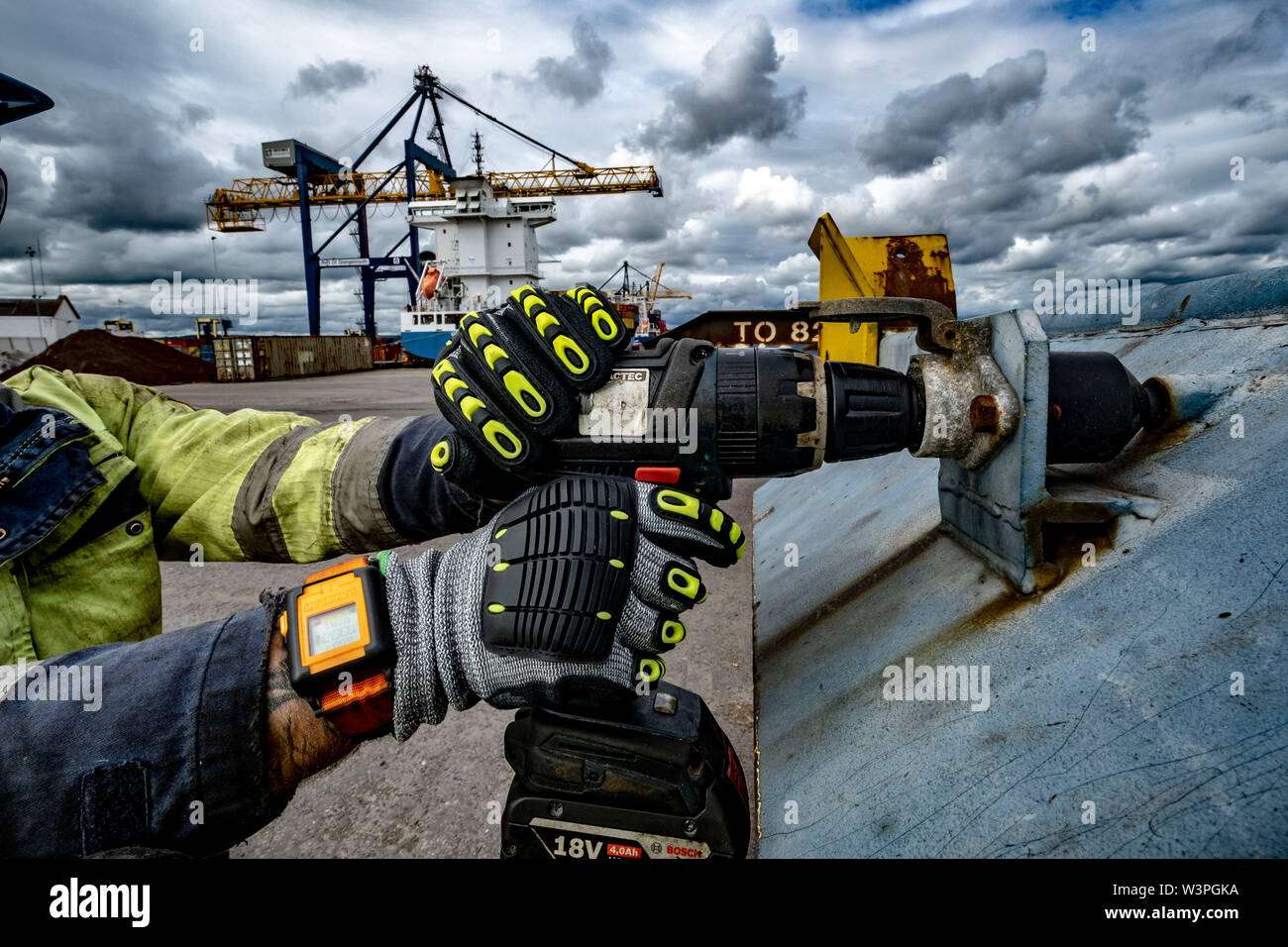 Skilled workers using power tools Stock Photo - Alamy