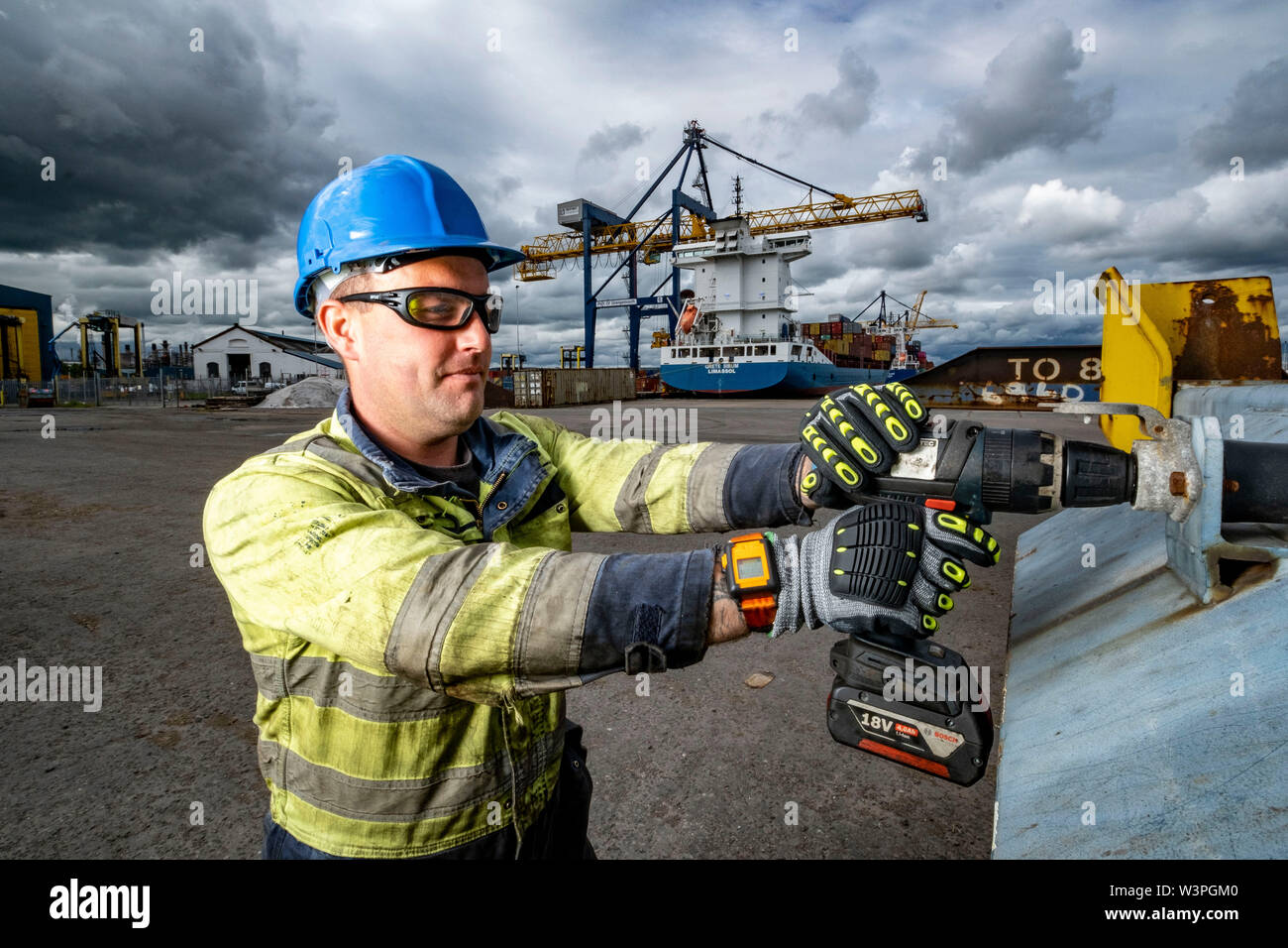 Skilled workers using power tools Stock Photo - Alamy