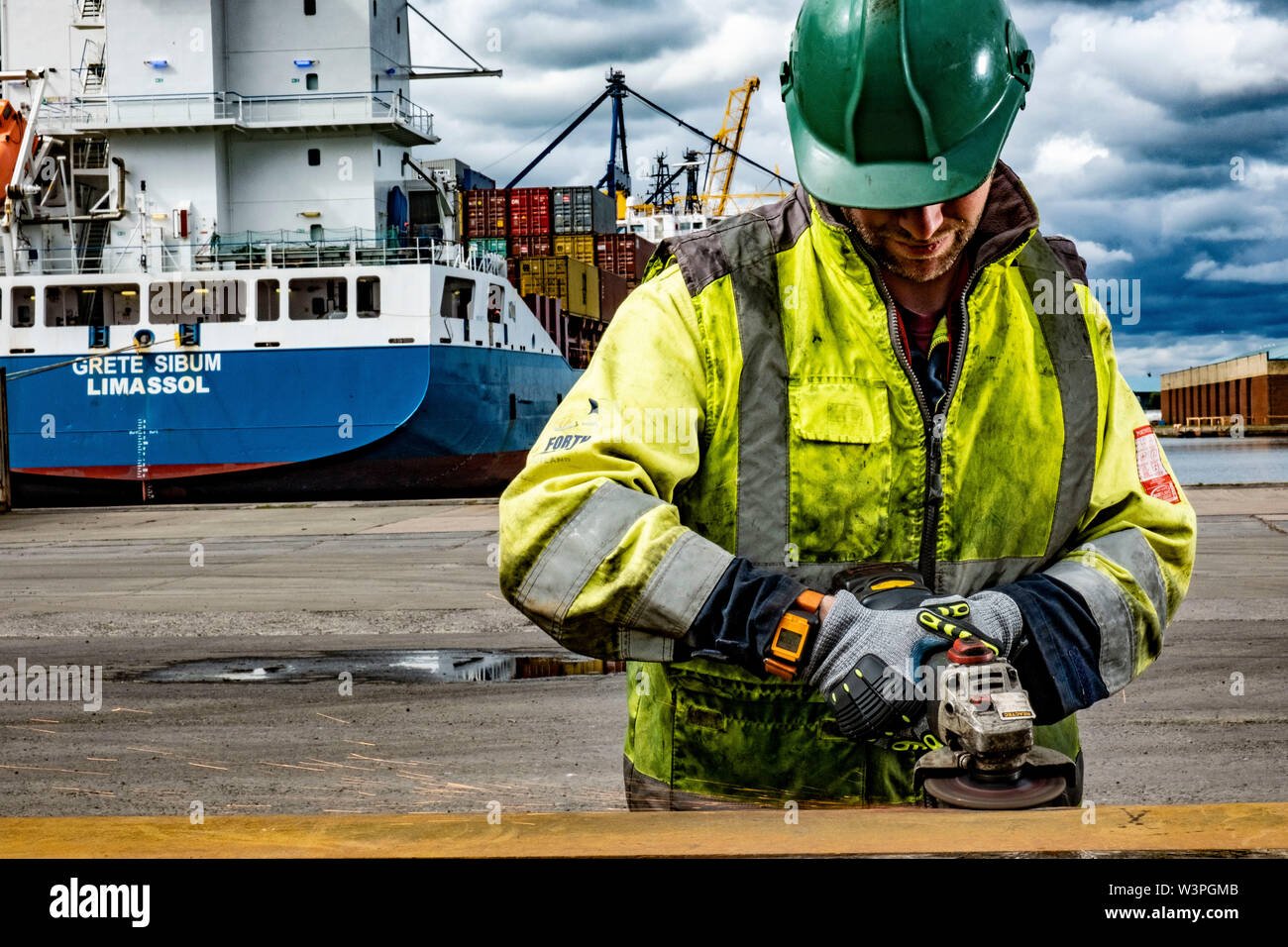 Skilled workers using power tools Stock Photo - Alamy