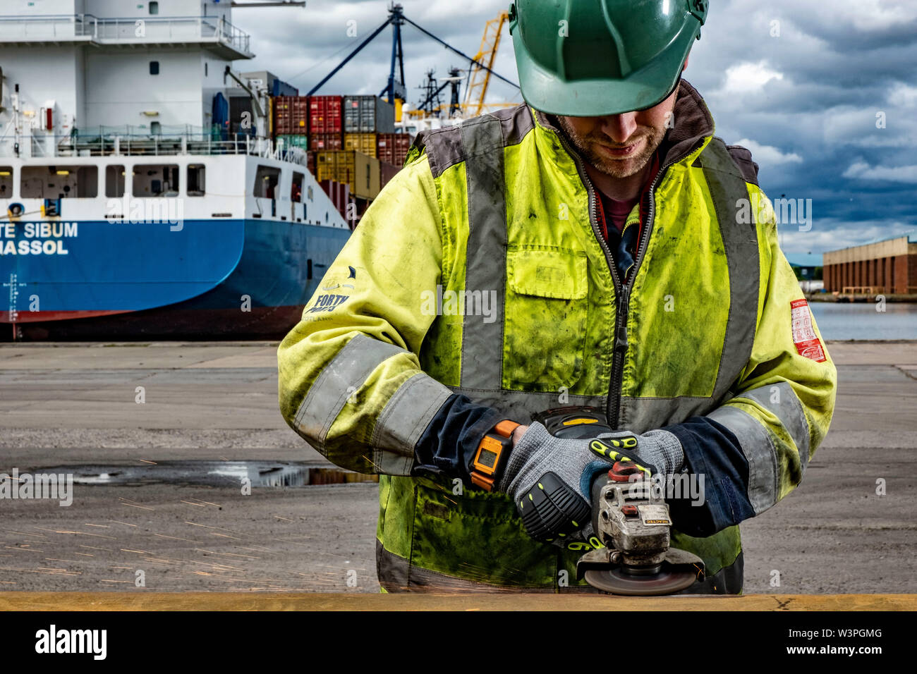 Skilled workers using power tools Stock Photo - Alamy