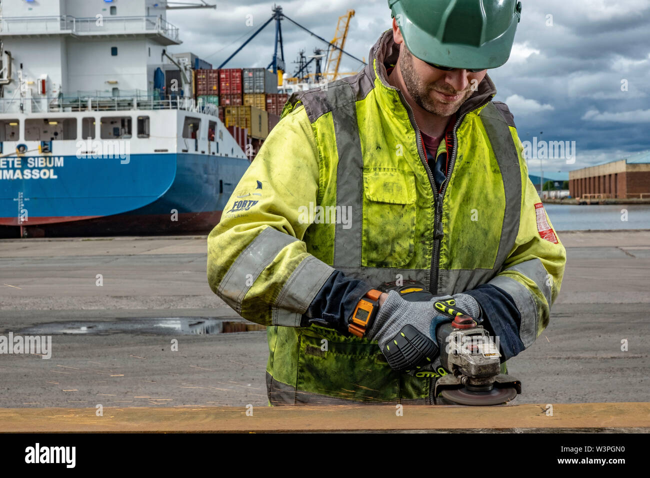 Skilled workers using power tools Stock Photo - Alamy
