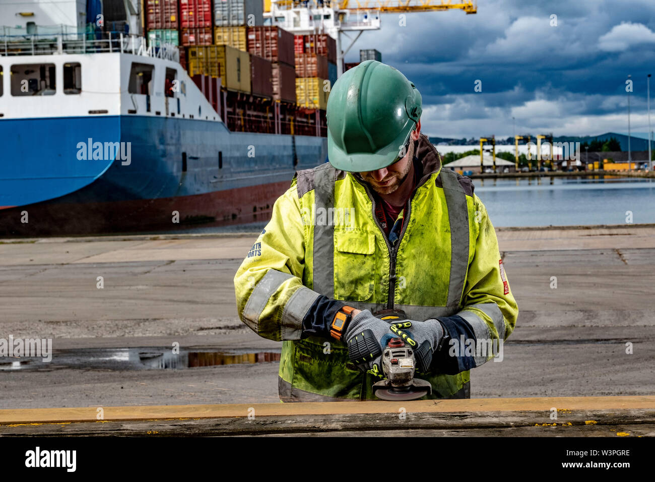 Skilled workers using power tools Stock Photo - Alamy