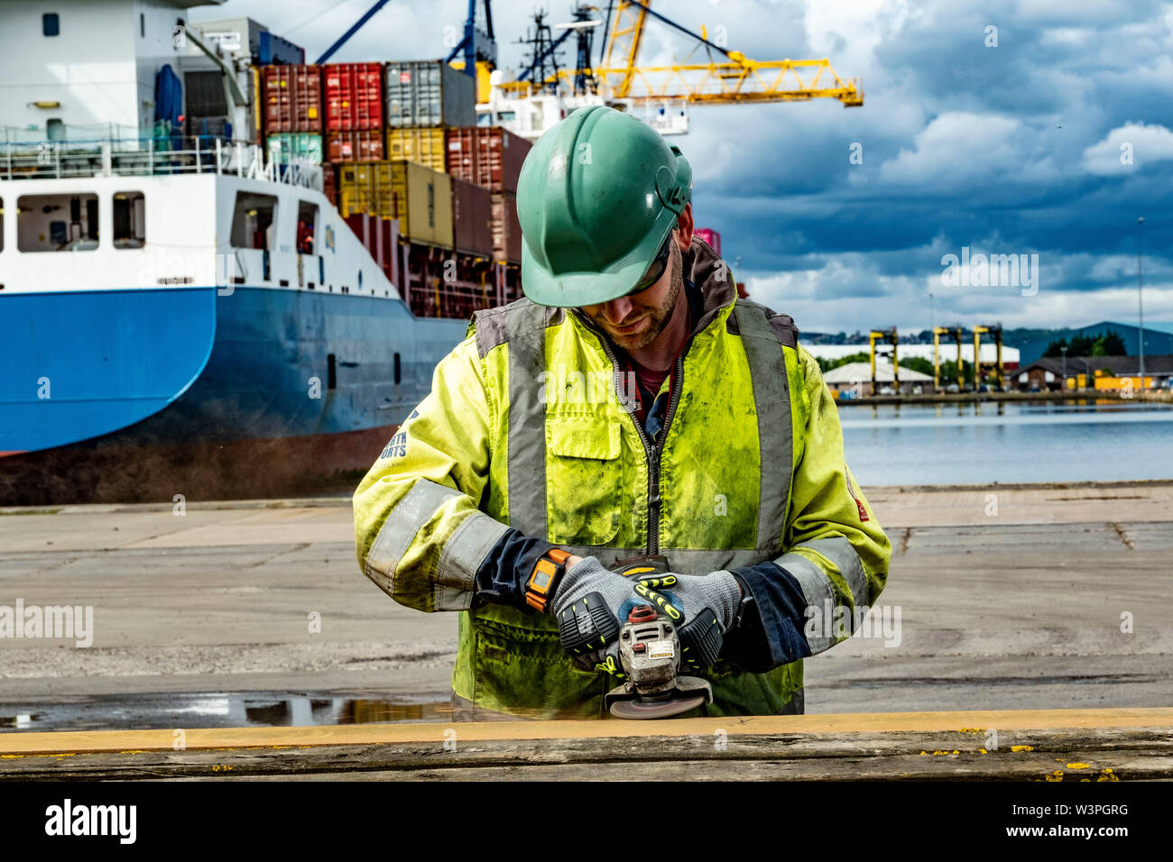 Skilled workers using power tools Stock Photo - Alamy
