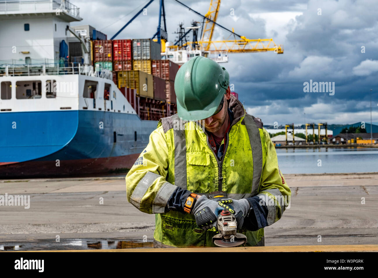 Skilled workers using power tools Stock Photo - Alamy
