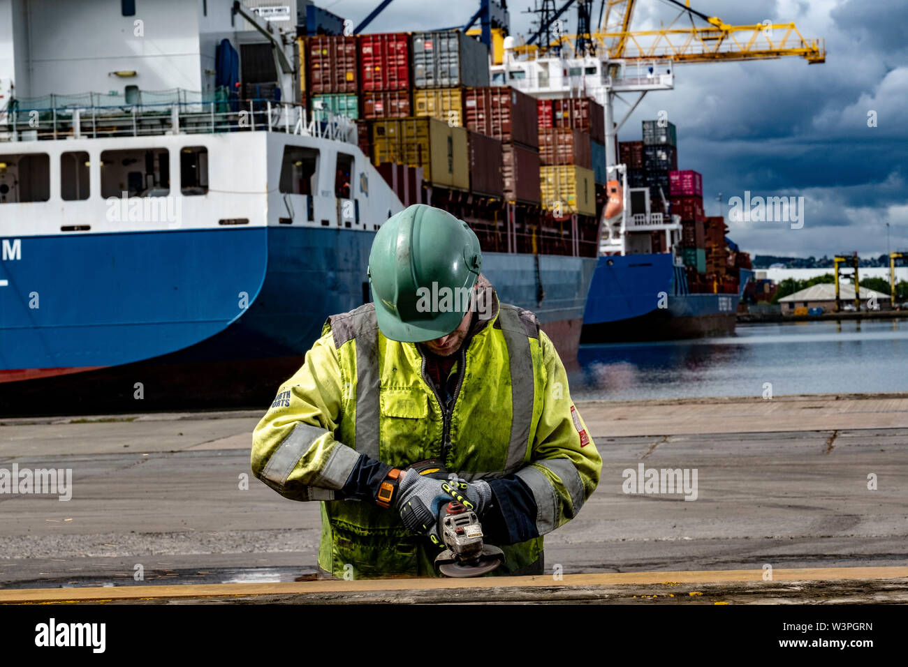 Skilled workers using power tools Stock Photo - Alamy