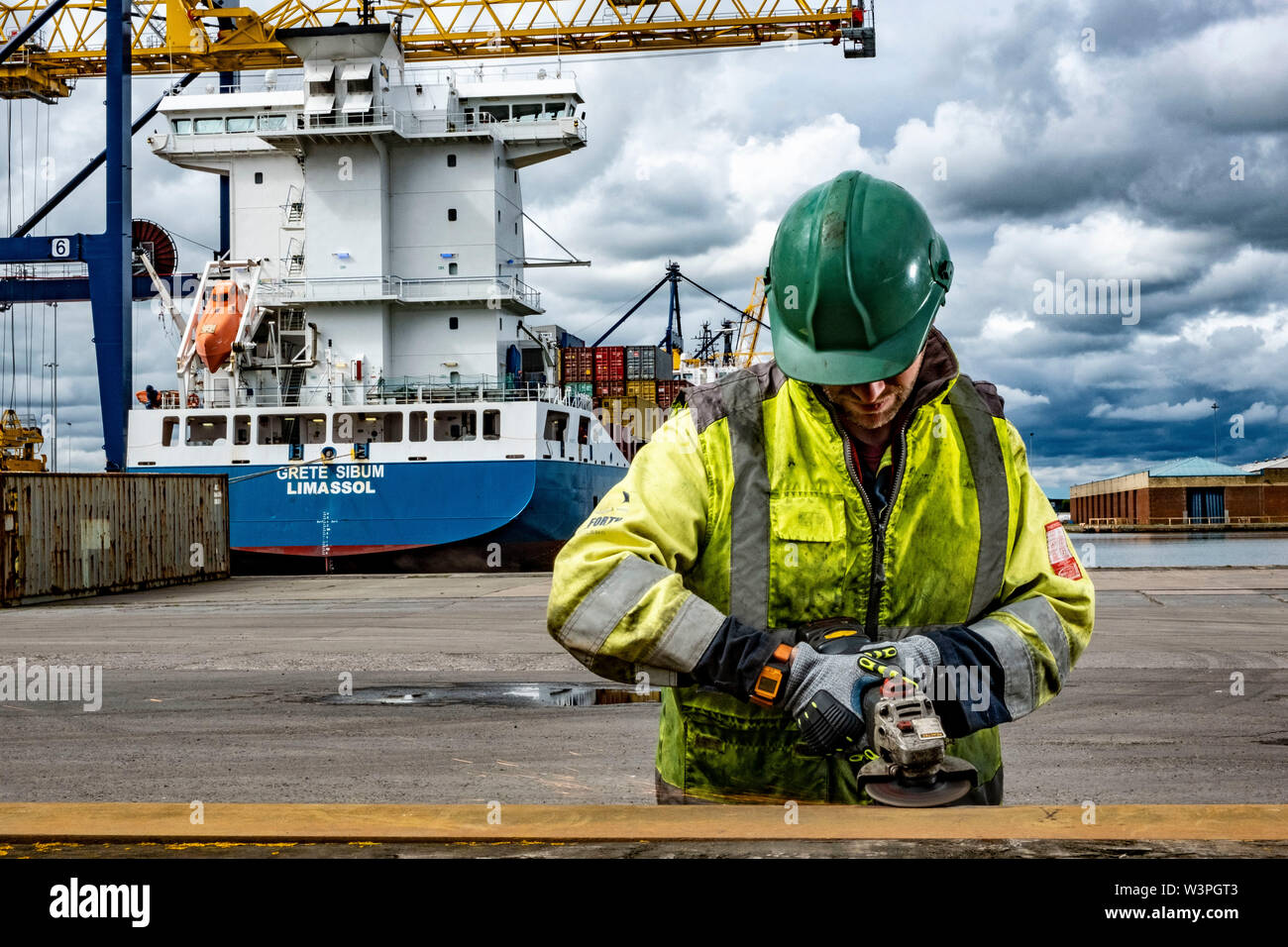 Skilled workers using power tools Stock Photo - Alamy