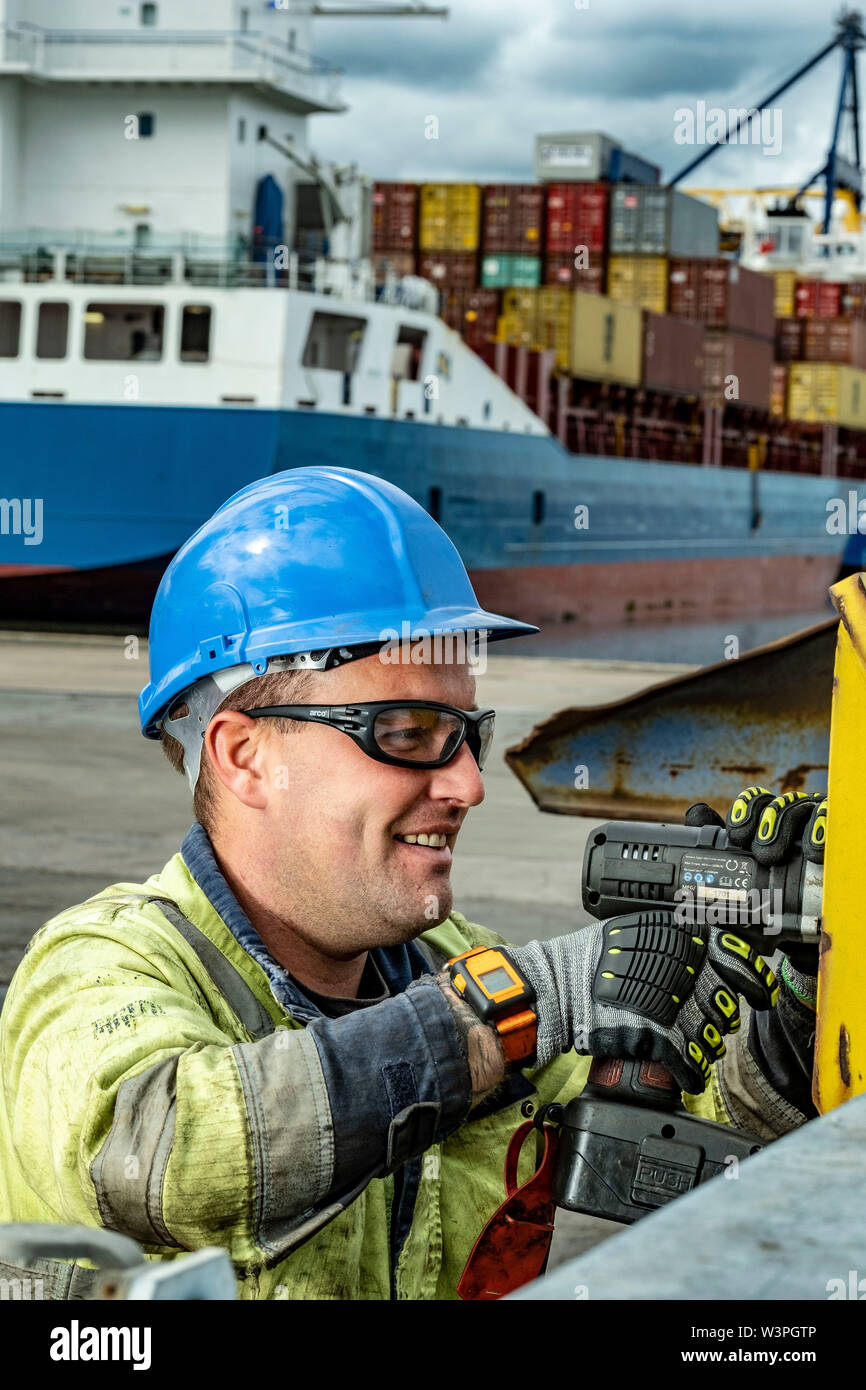 Skilled workers using power tools Stock Photo - Alamy