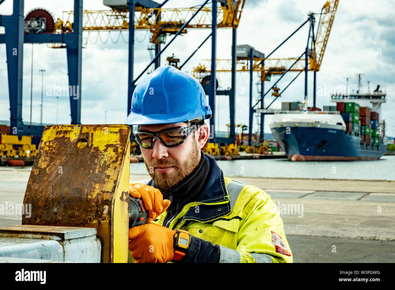 Skilled workers using power tools Stock Photo - Alamy
