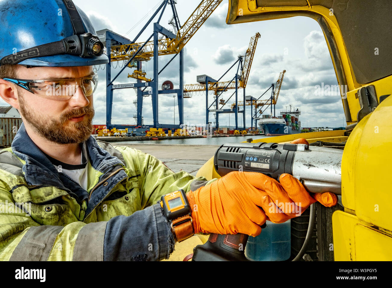 Skilled workers using power tools Stock Photo - Alamy
