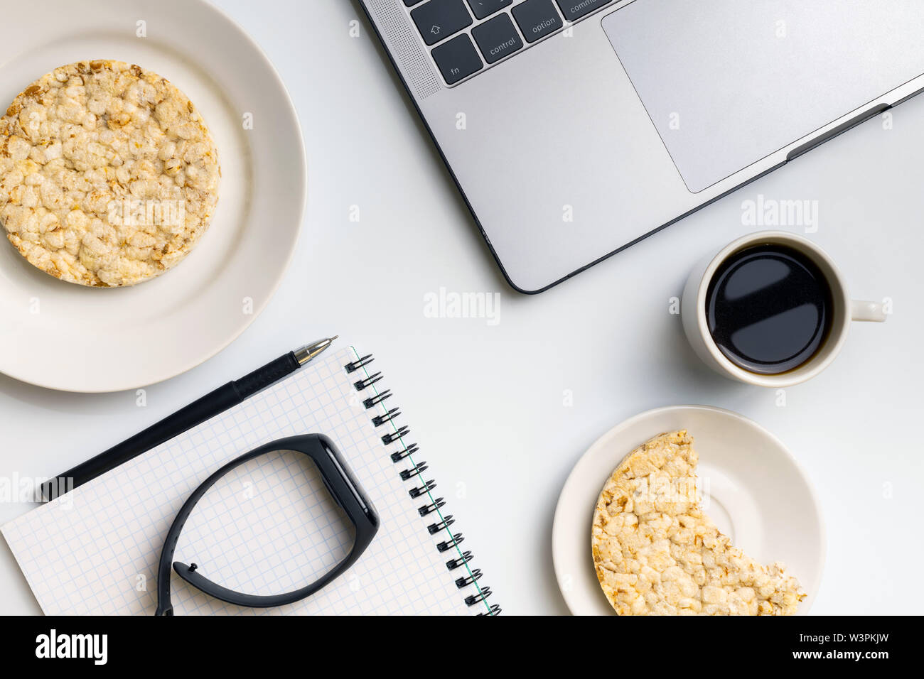 Healthy snacking at work during break time. Crispy rice rounds with ...