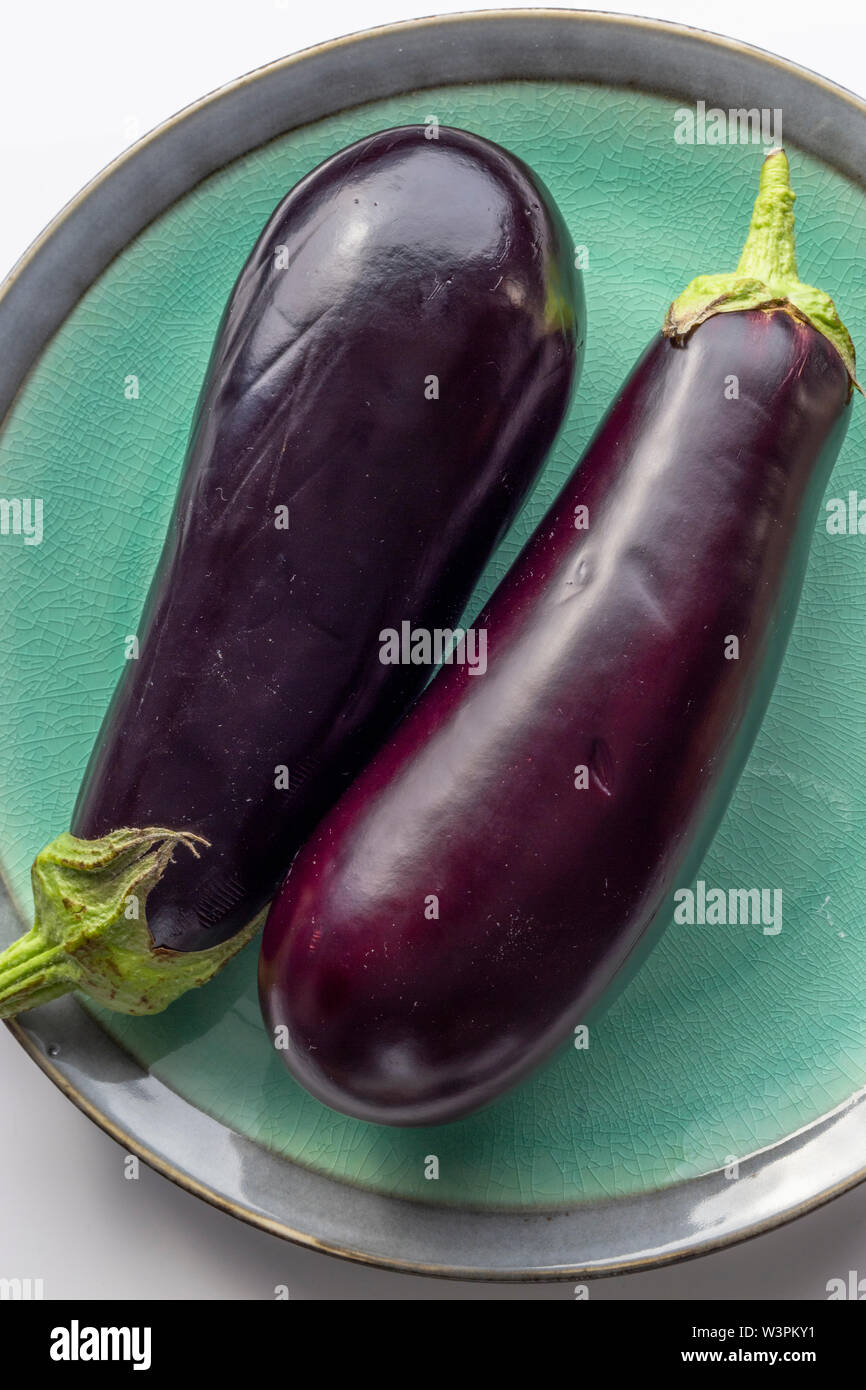 Two eggplants on plate hi-res stock photography and images - Alamy