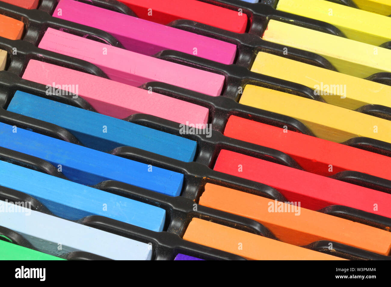 Colorful pastel chalks in box. Tools for artist Stock Photo - Alamy