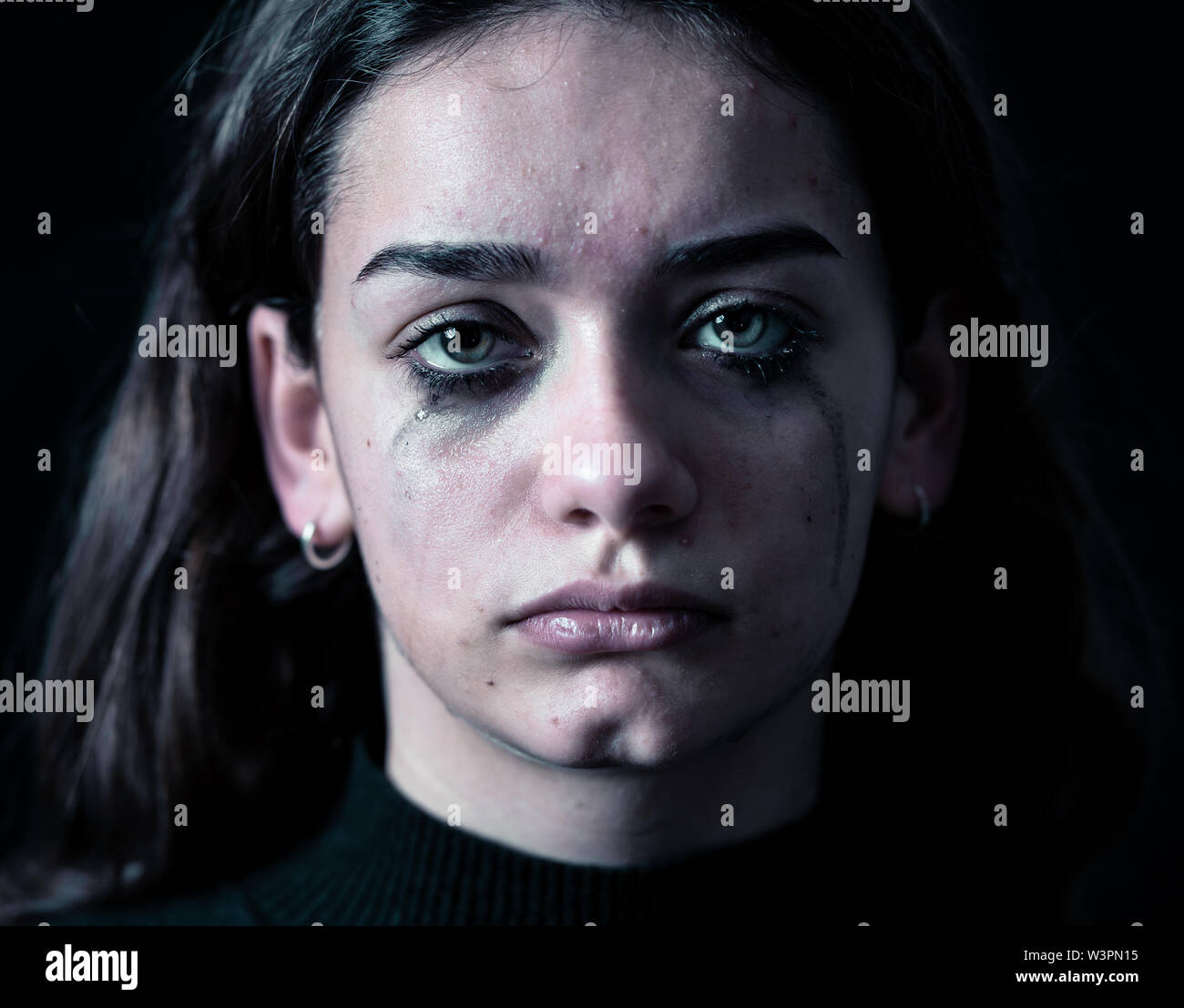 Scared upset girl bullied online suffering harassment crying feeling ...