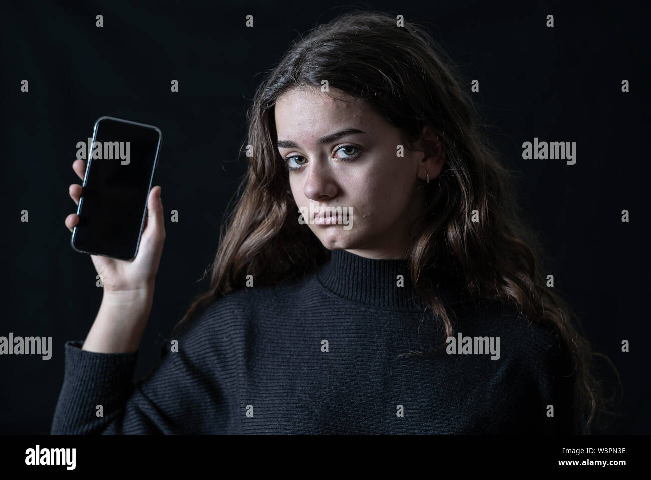 Scared upset girl bullied online suffering harassment crying feeling ...