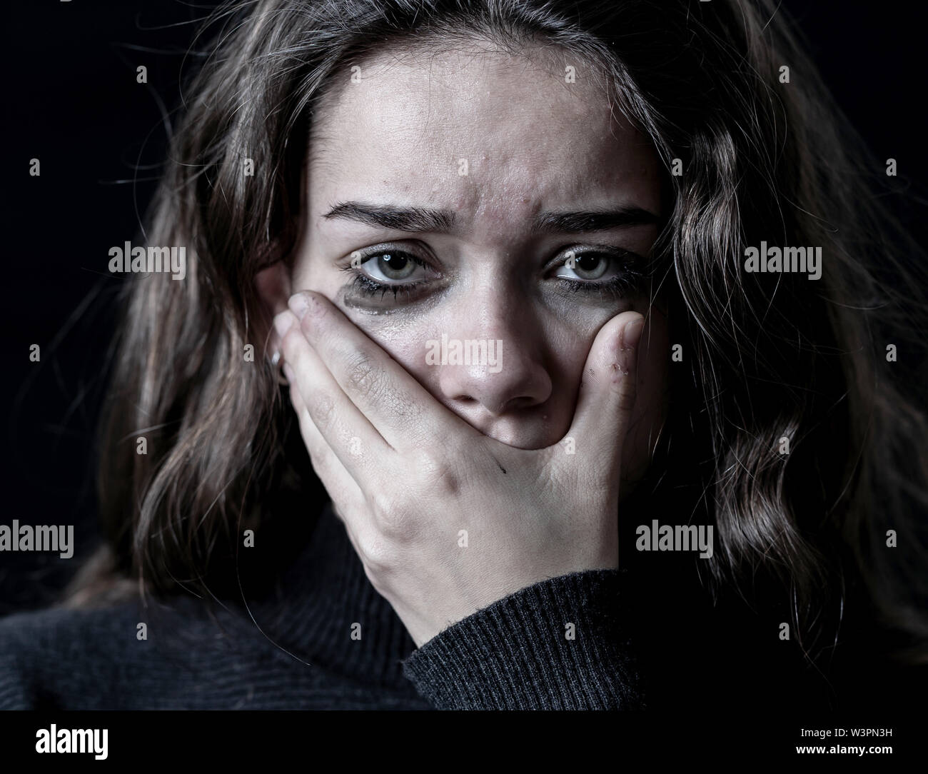 Dramatic closeup portrait of young scared, depressed girl crying alone ...