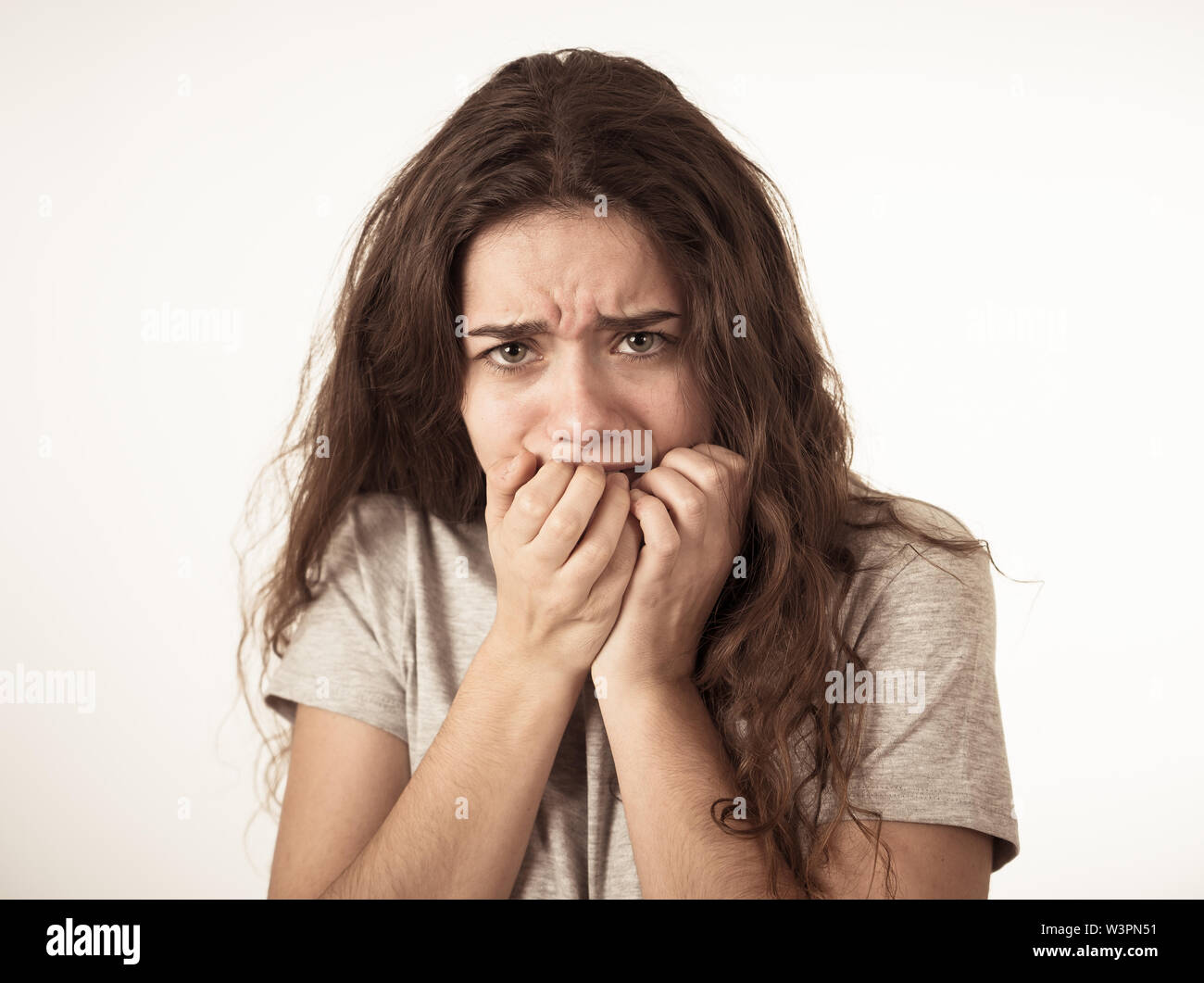 Close up portrait of scared and shocked young teenager female Looking ...