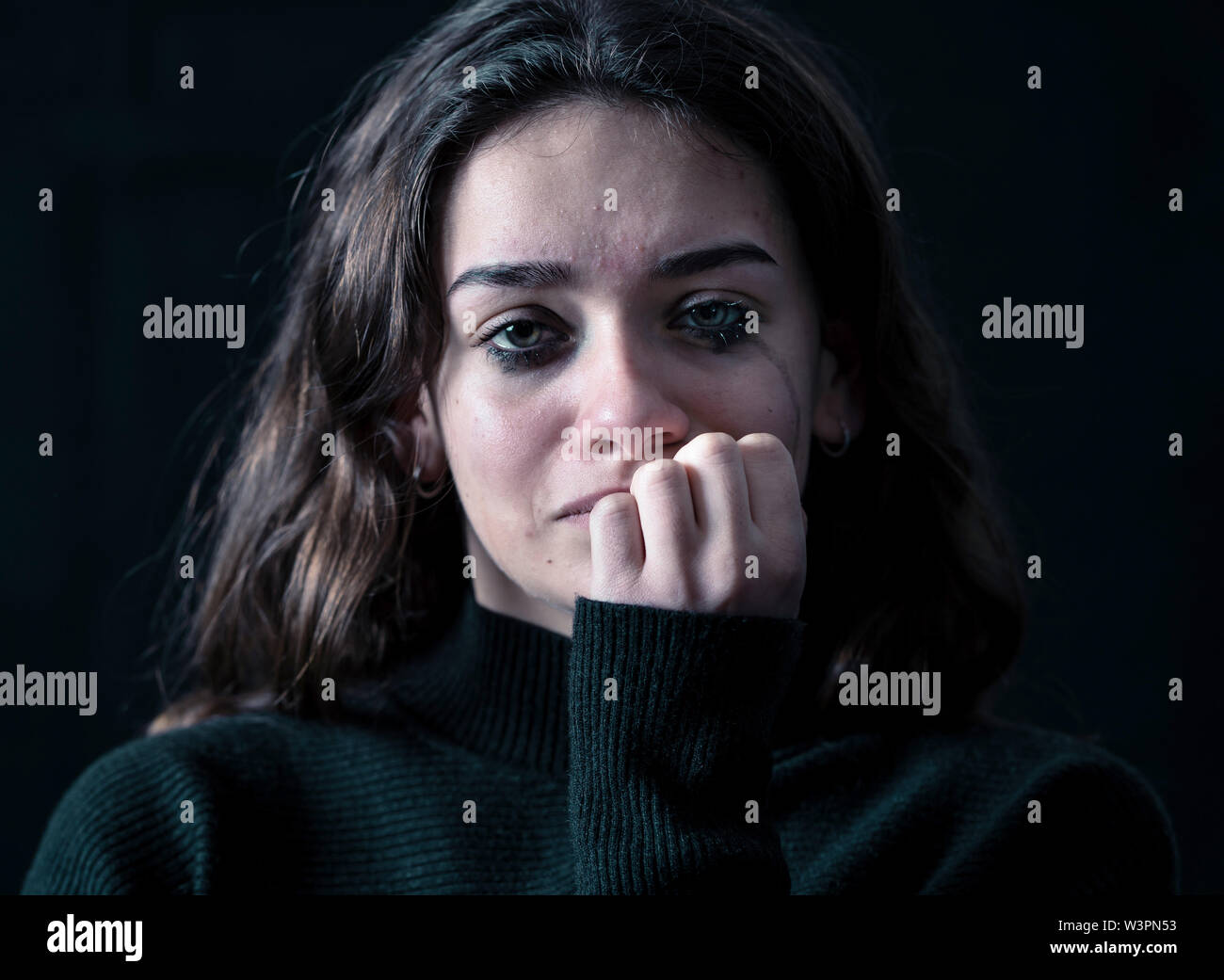Dramatic closeup portrait of young scared, depressed girl crying alone ...
